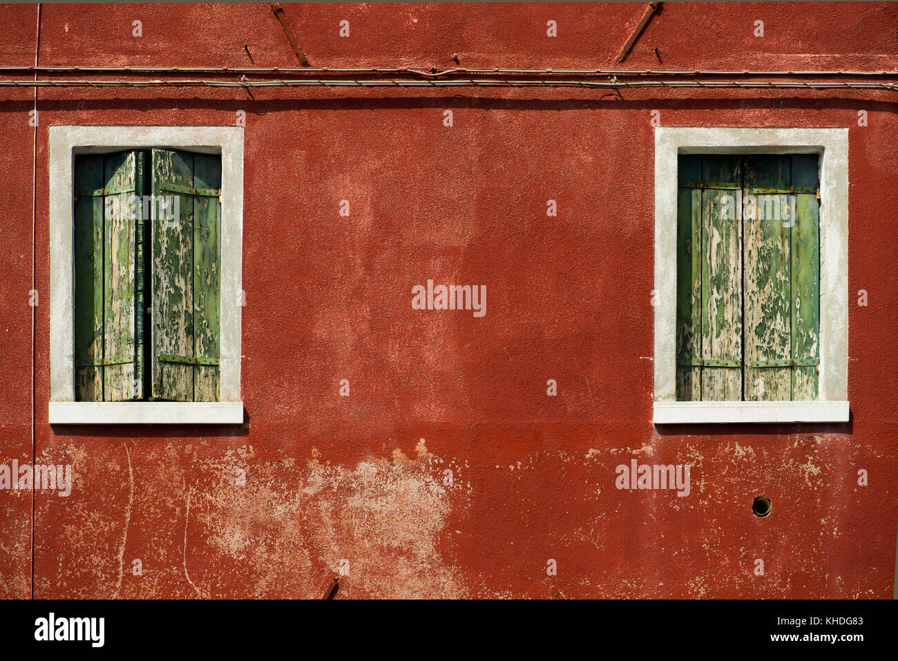 Building exterior with shuttered windows Stock Photo - Alamy