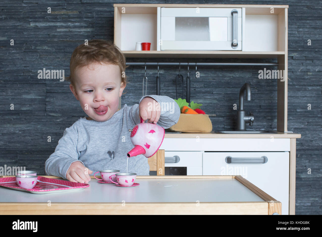 Children playing tea party hi-res stock photography and images - Alamy
