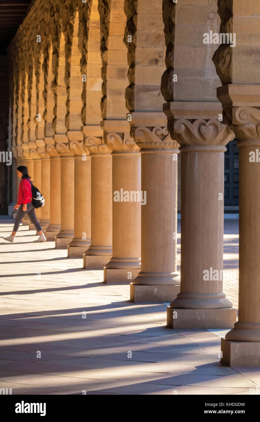 Female student was walking through the arch columns in Stanford ...