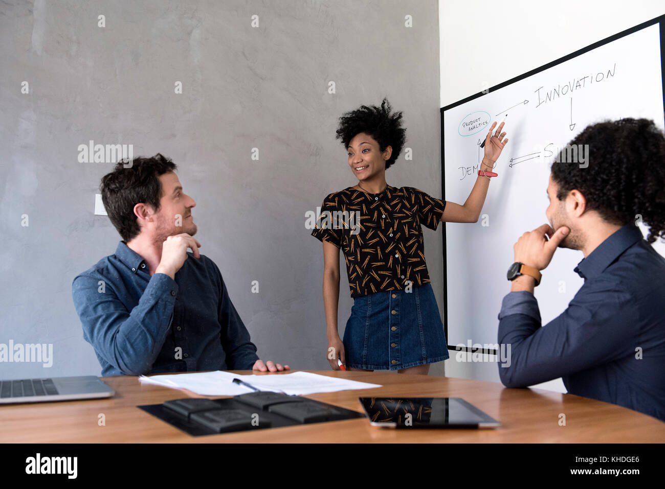 Woman giving presentation to class Stock Photo - Alamy