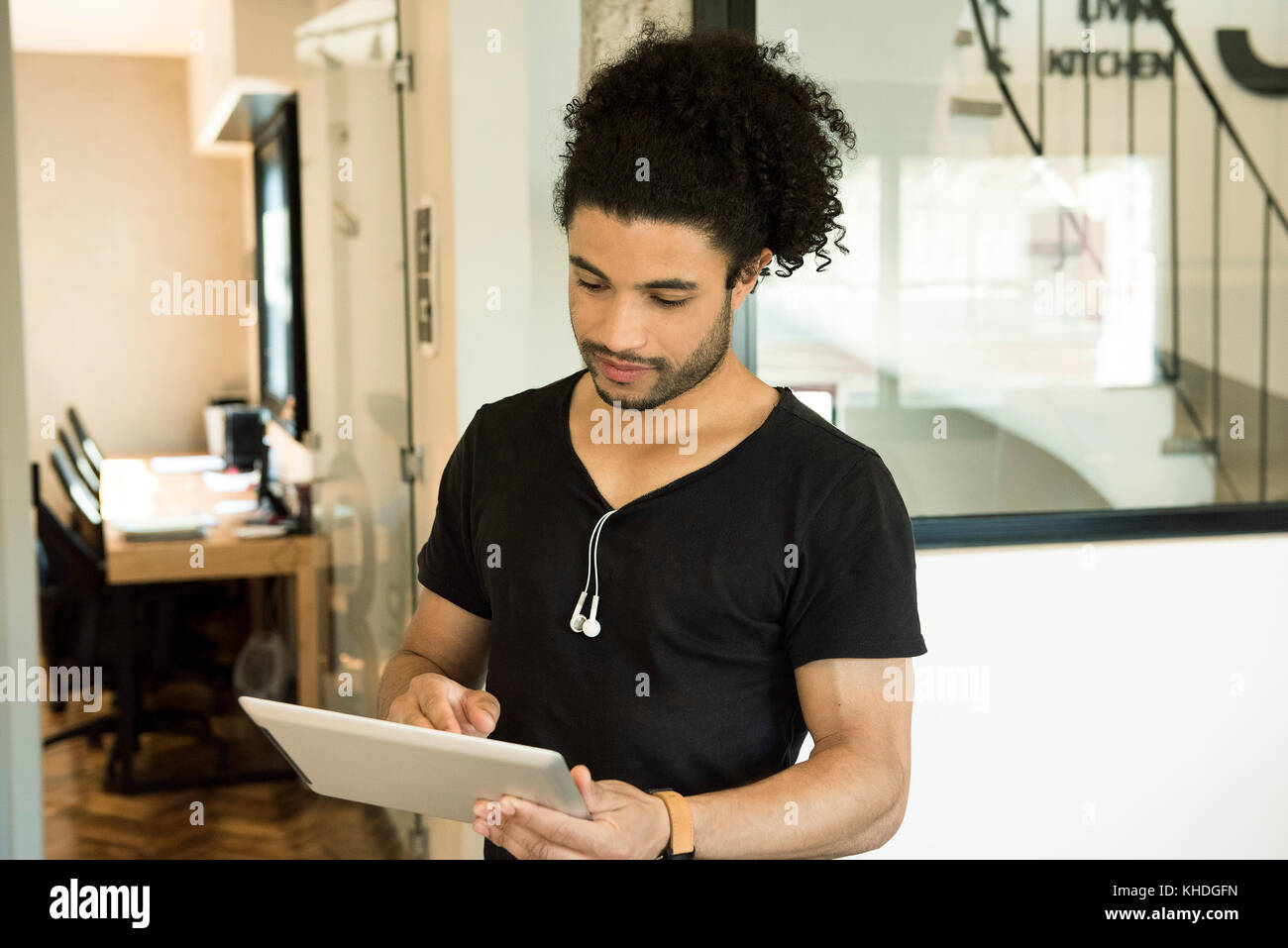 Young man using digital tablet Stock Photo - Alamy