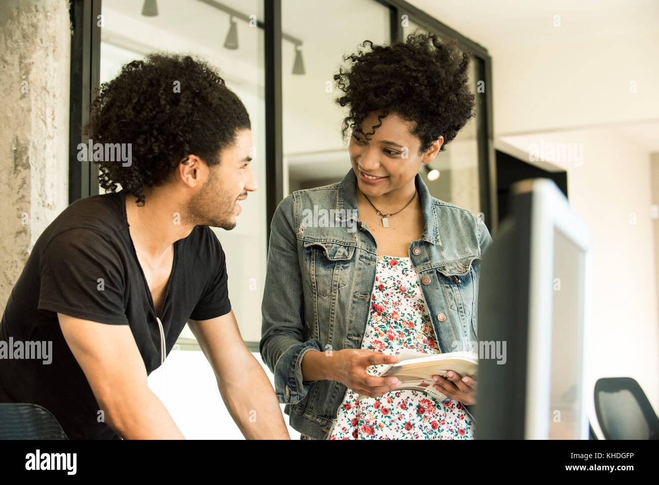 Smiling african man chatting colleagues hi-res stock photography and images - Alamy