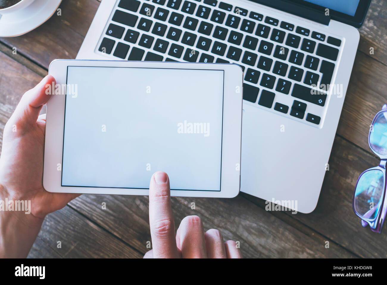 hands holding digital tablet computer with empty blank screen, person ...