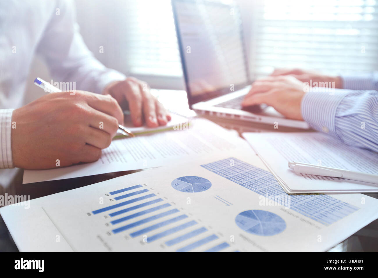 business team working with charts in the office Stock Photo - Alamy