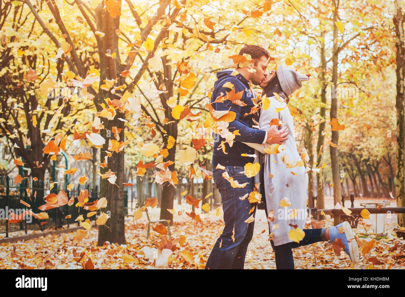 autumn love, couple kissing in fall park, happy man and woman outside ...