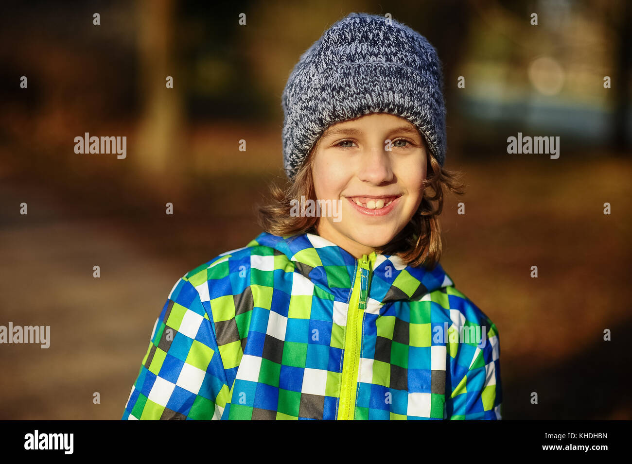 Portrait of a smiling boy of 9-10 years. The boy is dressed in a ...
