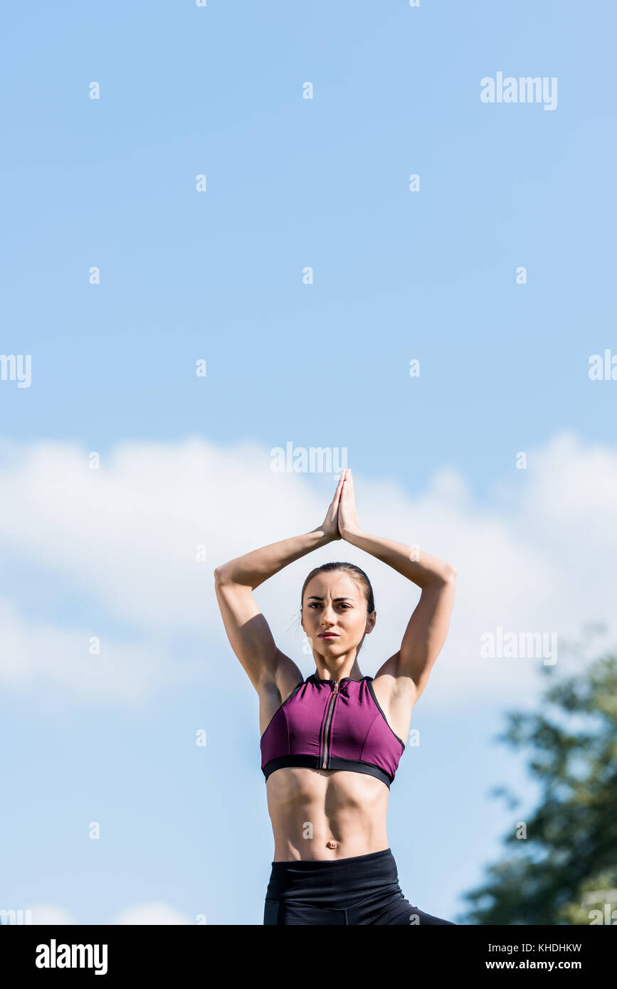 woman in tree pose Stock Photo - Alamy