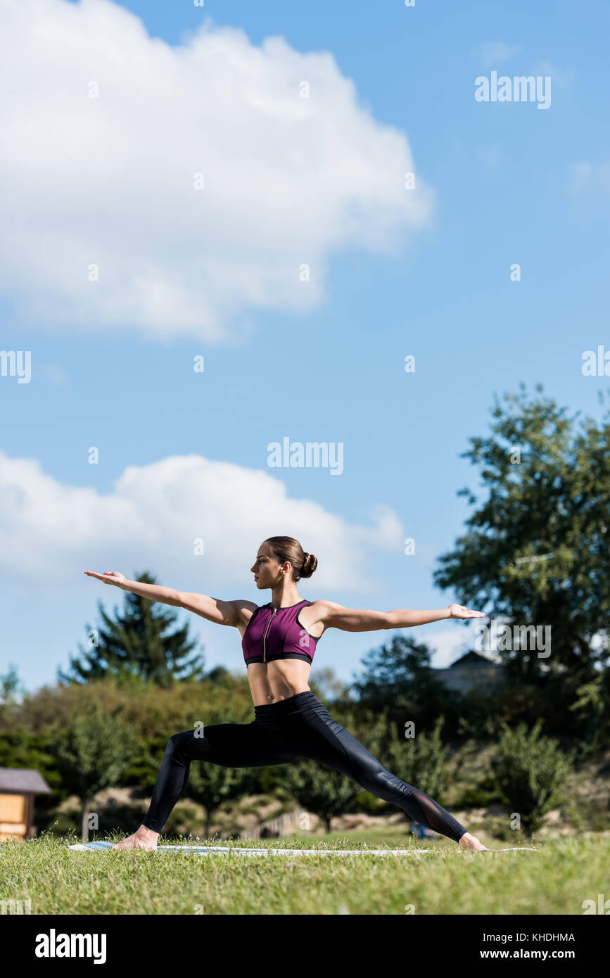 woman in warrior pose Stock Photo - Alamy
