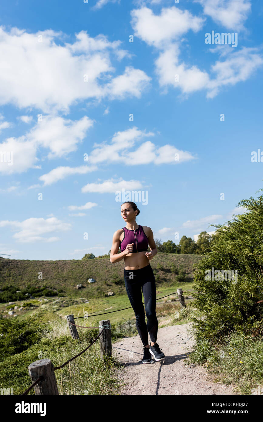 woman jogging on rural road Stock Photo - Alamy