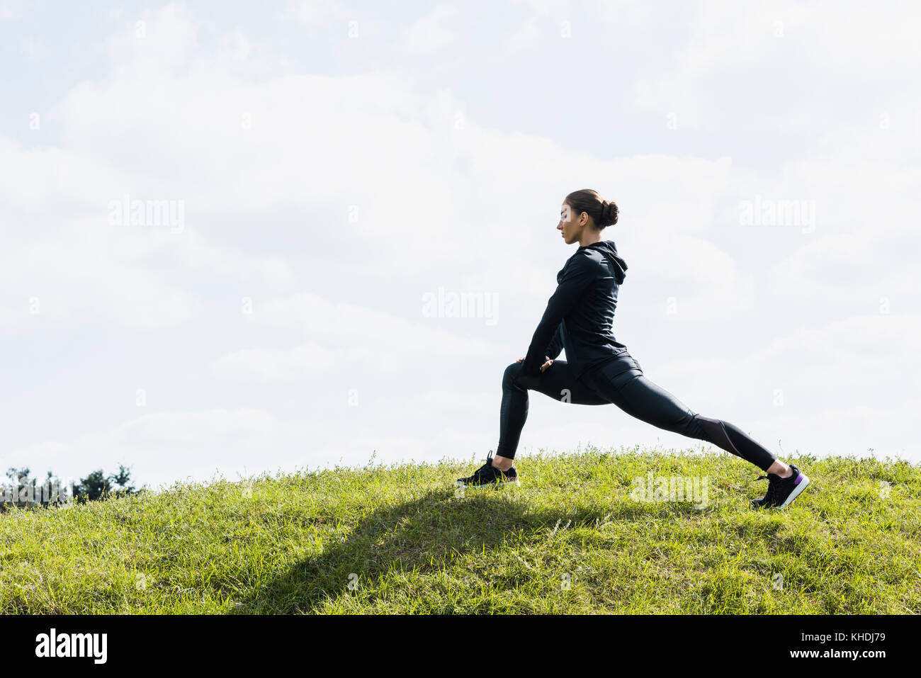 fit woman stretching legs Stock Photo - Alamy