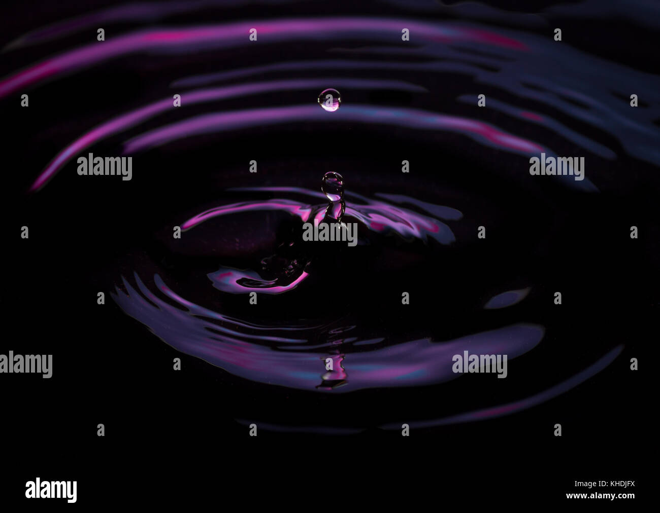 water drop with purple reflection Stock Photo - Alamy