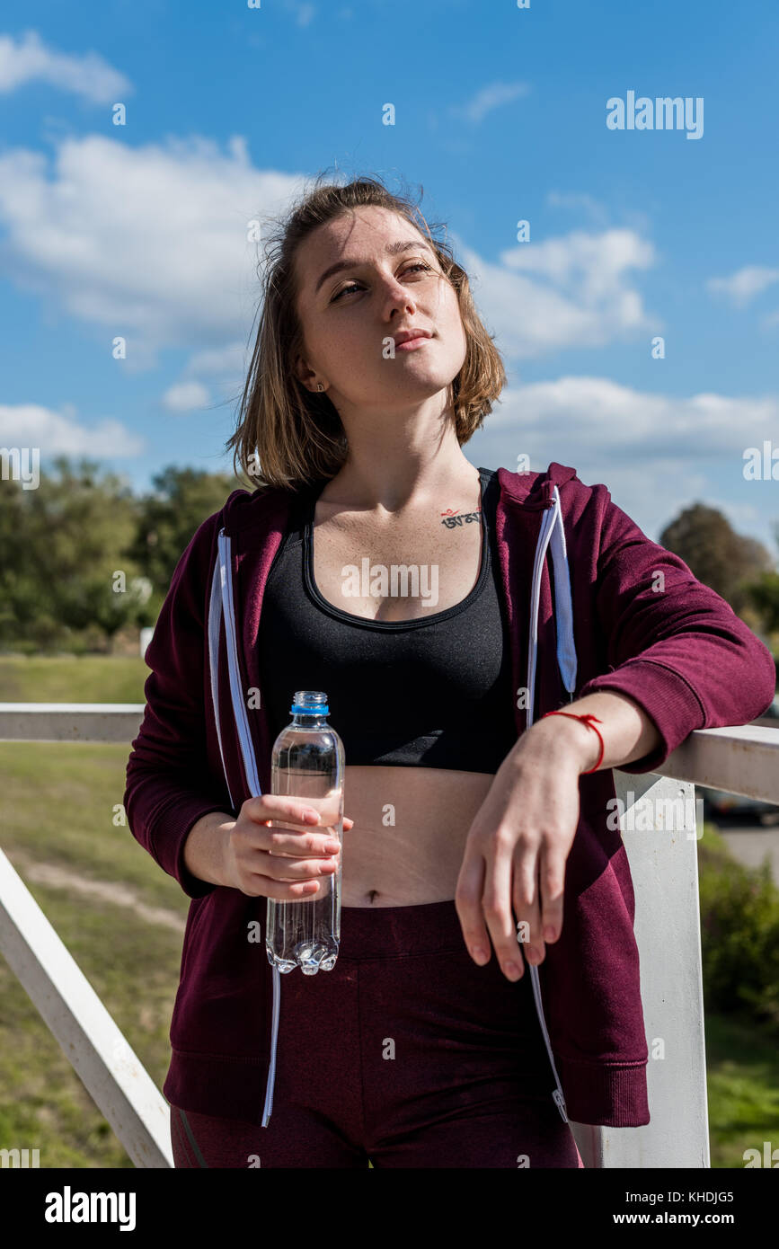 woman relaxing after workout Stock Photo - Alamy