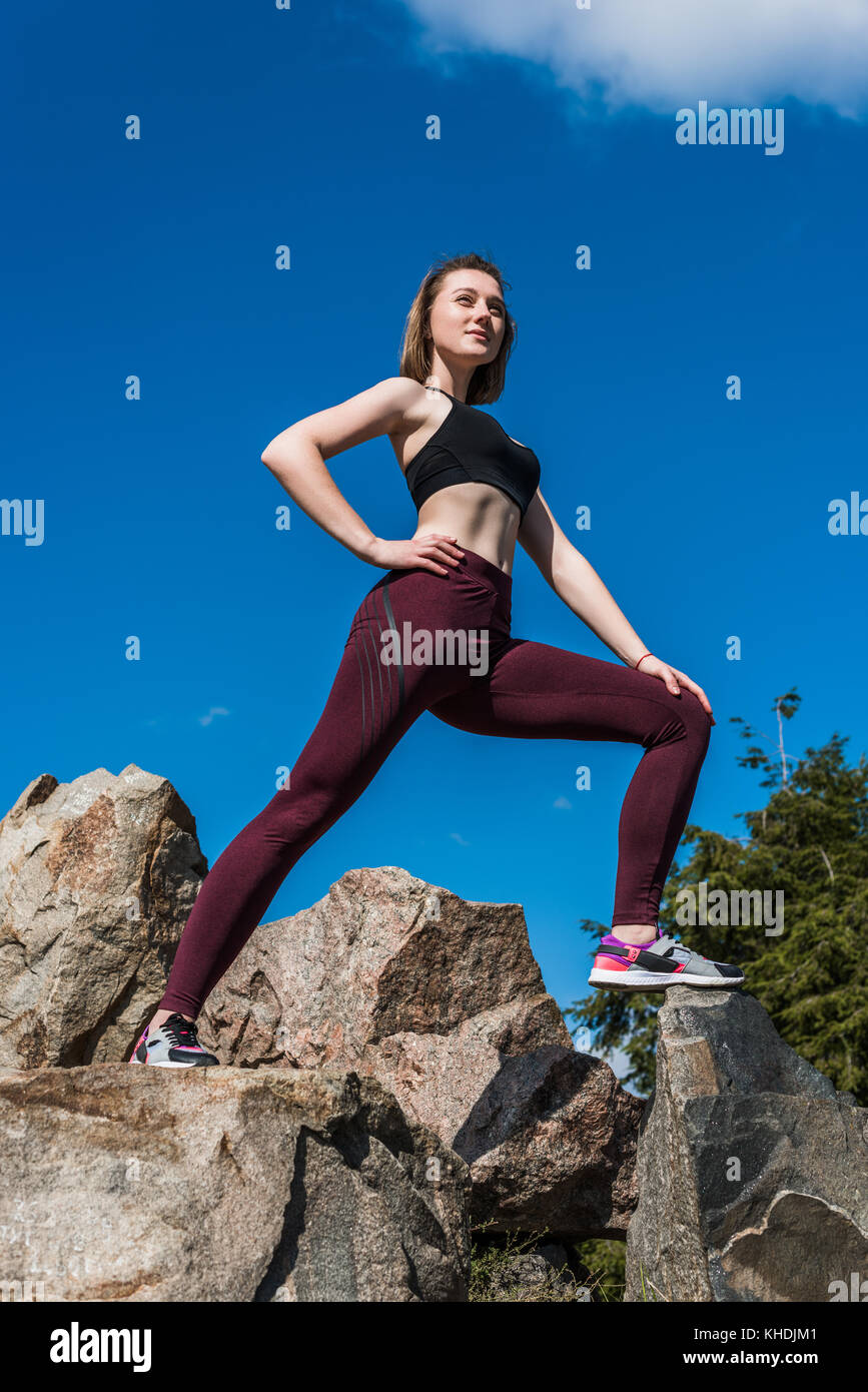 fit woman on rocks Stock Photo - Alamy