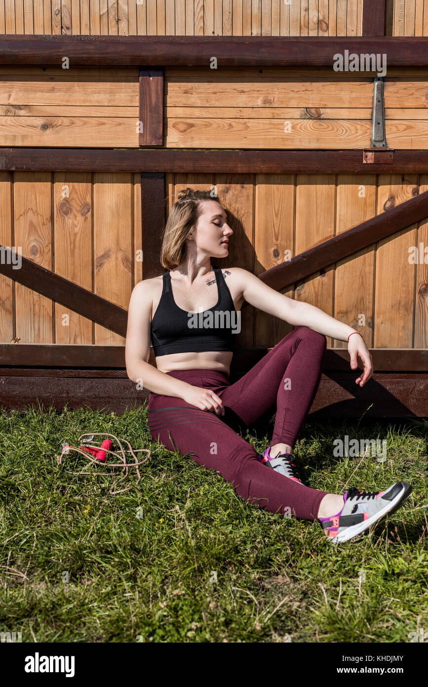 woman relaxing aftre training Stock Photo - Alamy