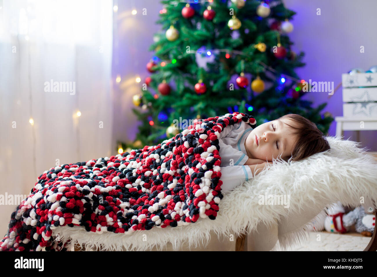 Boy sleeping under tree hi-res stock photography and images - Alamy