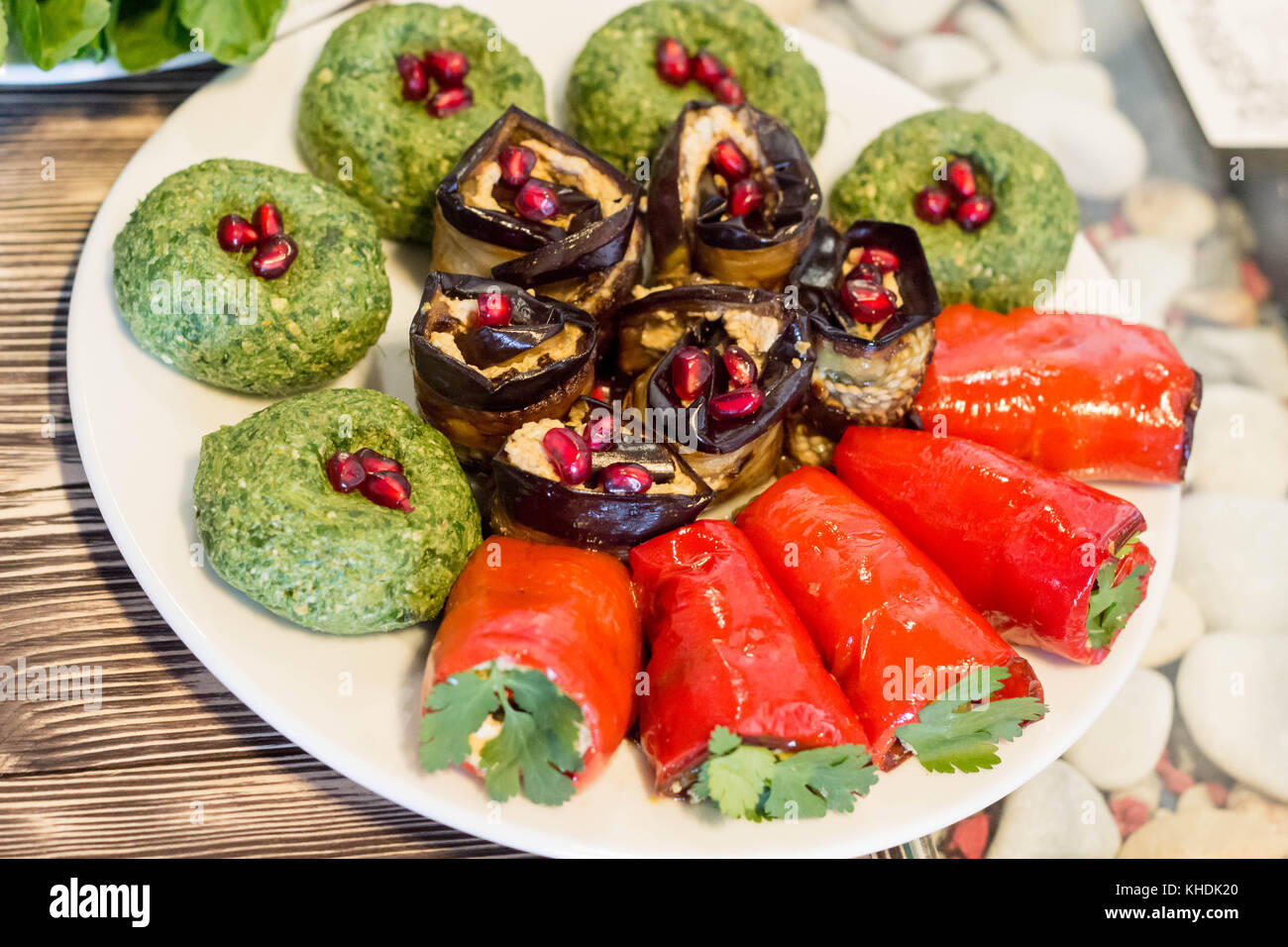 Traditional georgian food : Badridżani and stuffed vegetables Stock ...