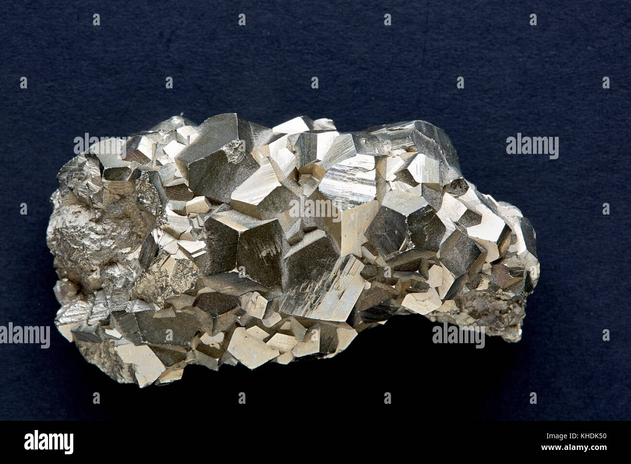A specimen of a rough pyrites rock with a dark background Stock Photo ...