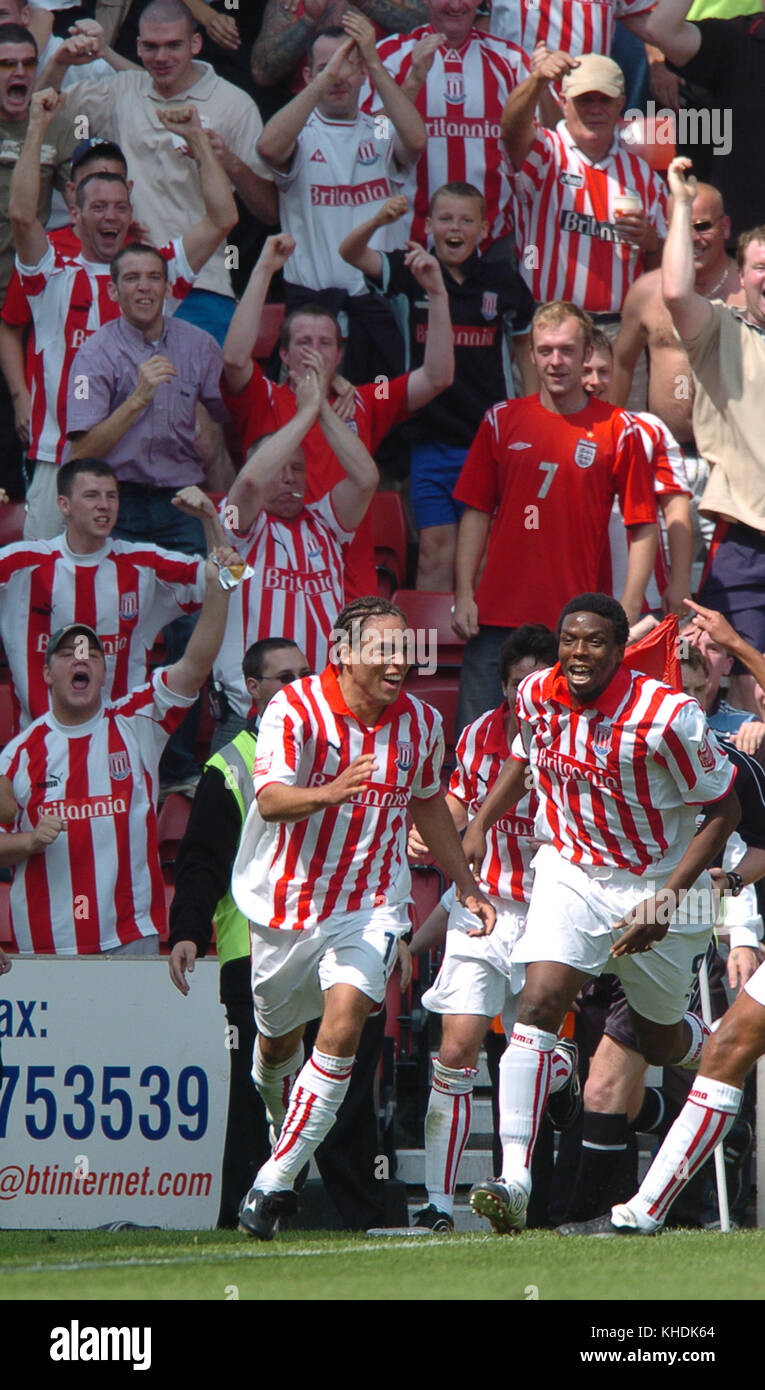 Footballer Darel Russell celebrates his goal with Gifton Noel-Williams ...
