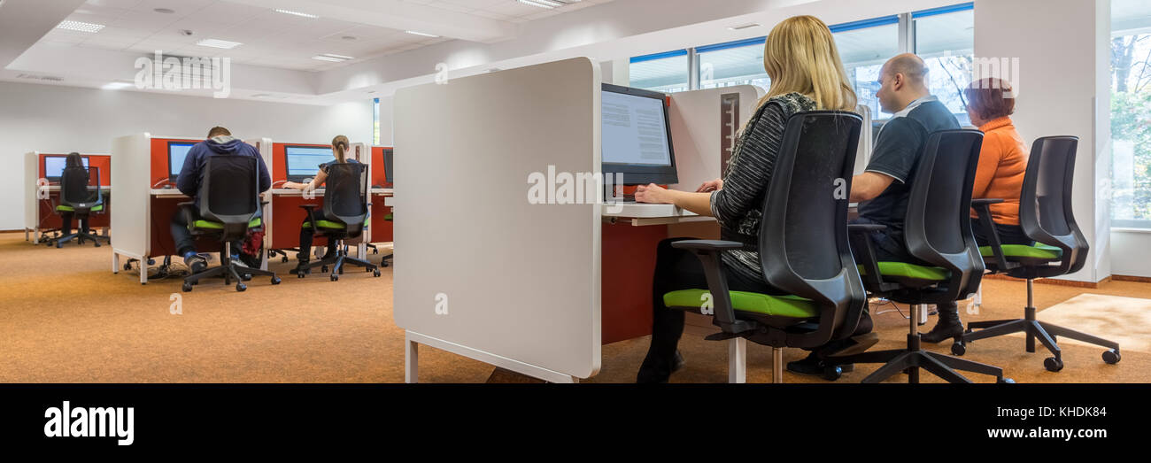 Panoramic view of modern IT classroom interior with orange carpet ...