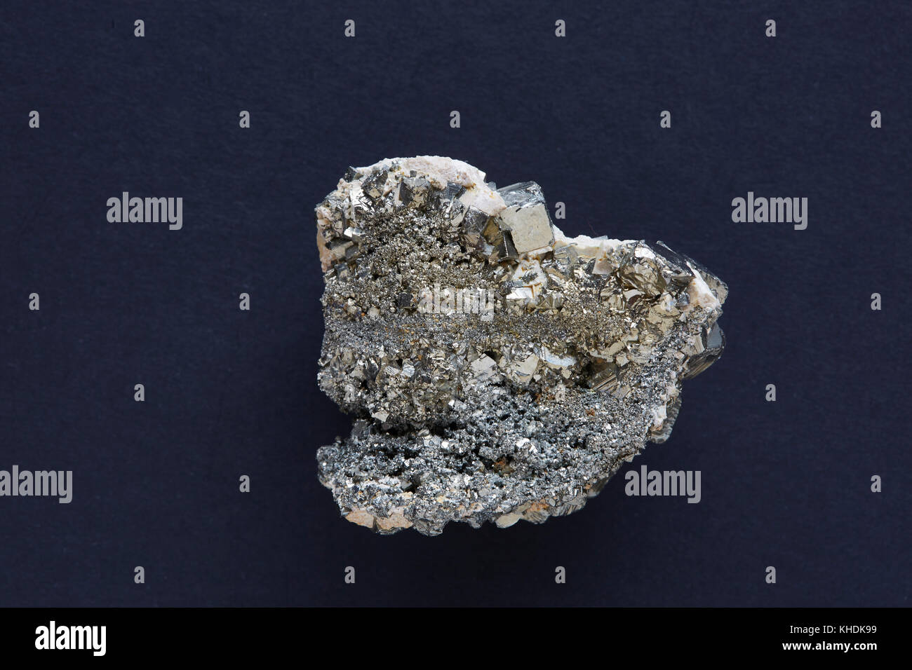A specimen of a rough pyrites rock with a dark background Stock Photo ...