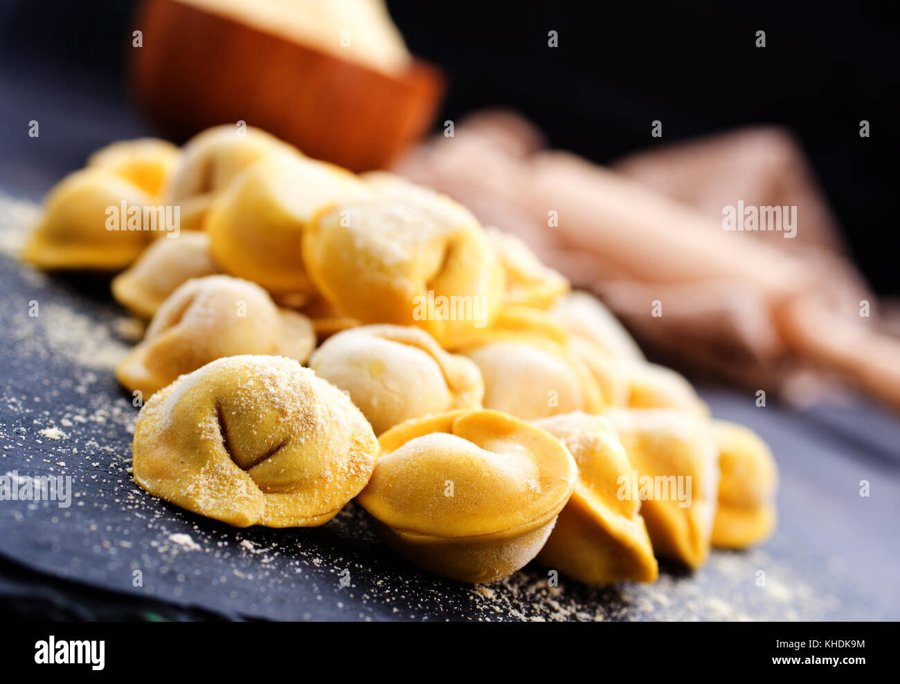 raw dumplings on board and on a table Stock Photo - Alamy