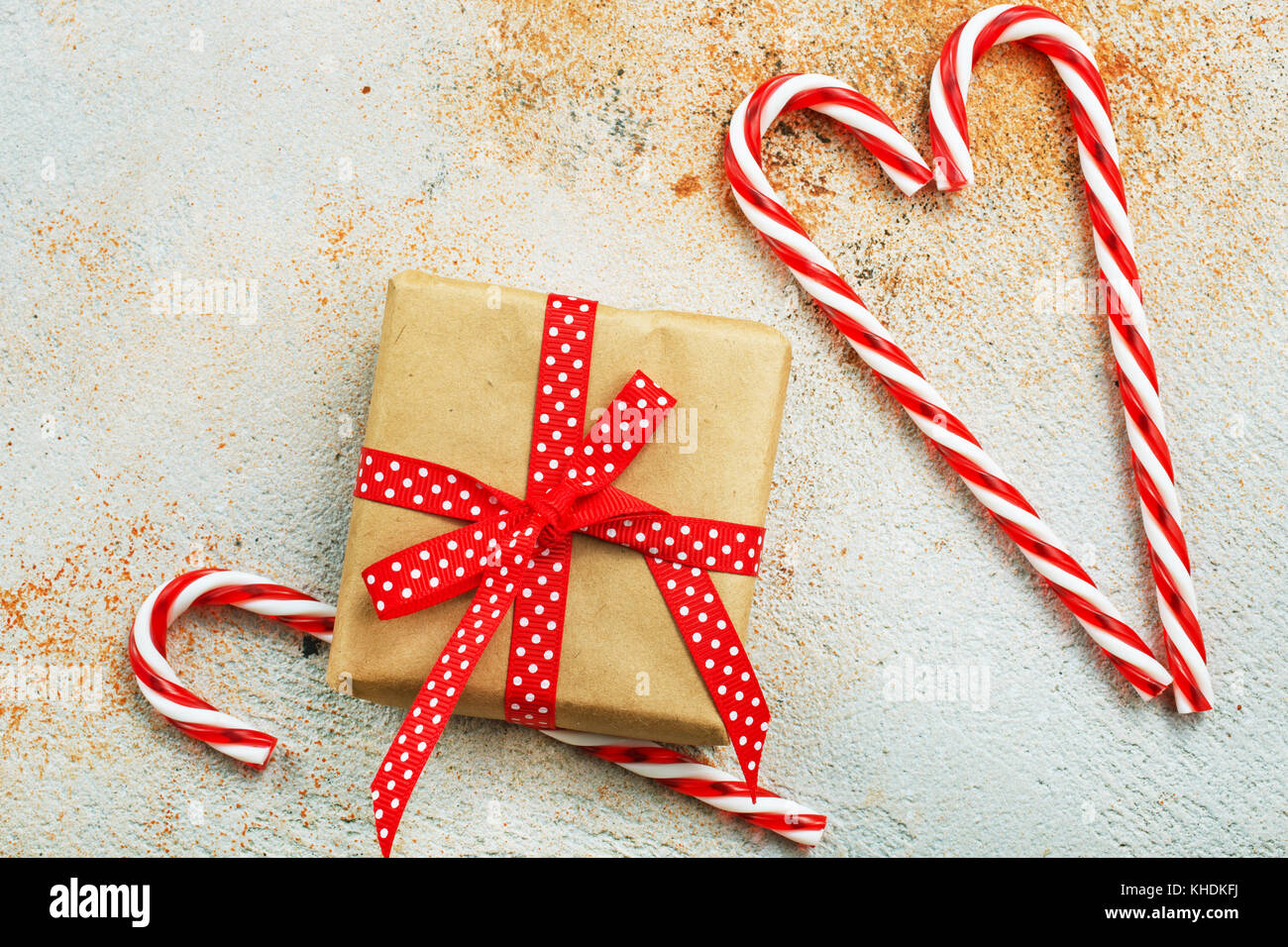 box for present and candy cane on a table Stock Photo - Alamy
