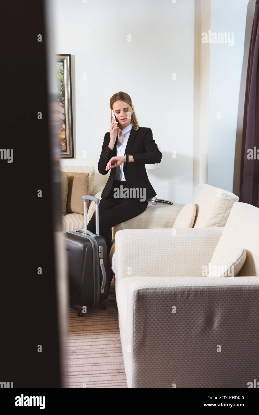 businesswoman with smartphone in hotel room Stock Photo - Alamy