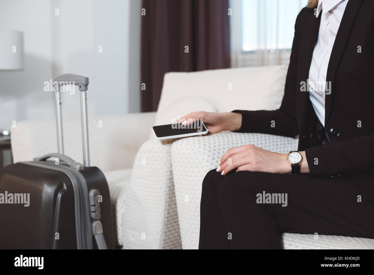 businesswoman with smartphone in hotel room Stock Photo - Alamy