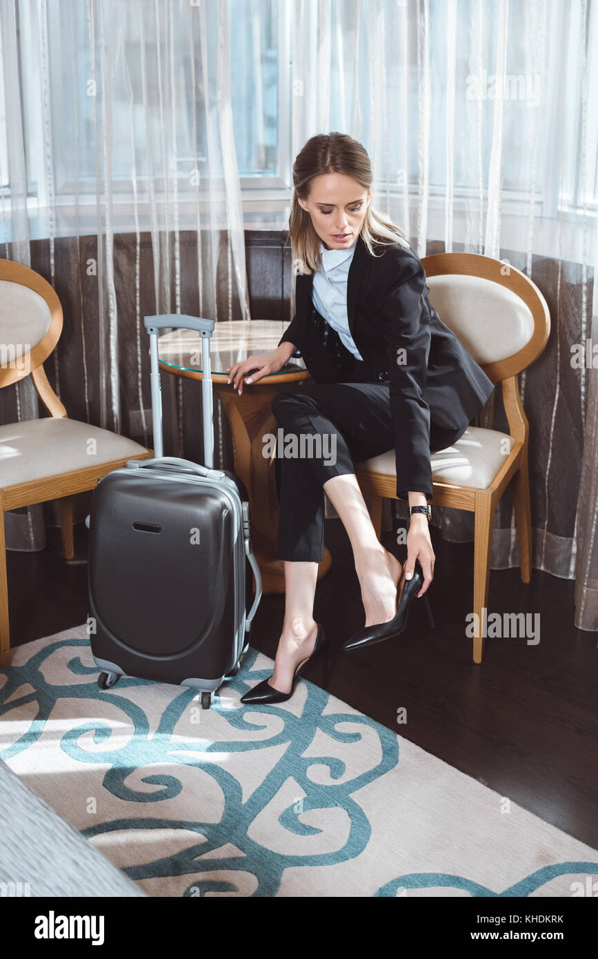 businesswoman with high heeled shoes in hotel room Stock Photo - Alamy