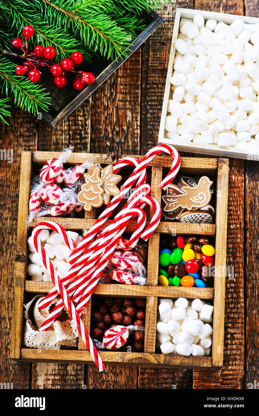 christmas candy in box and on a table Stock Photo - Alamy