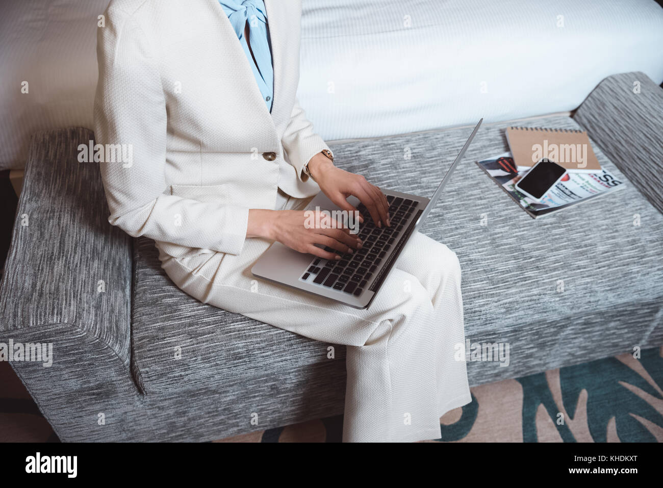 businesswoman using laptop in hotel room Stock Photo - Alamy