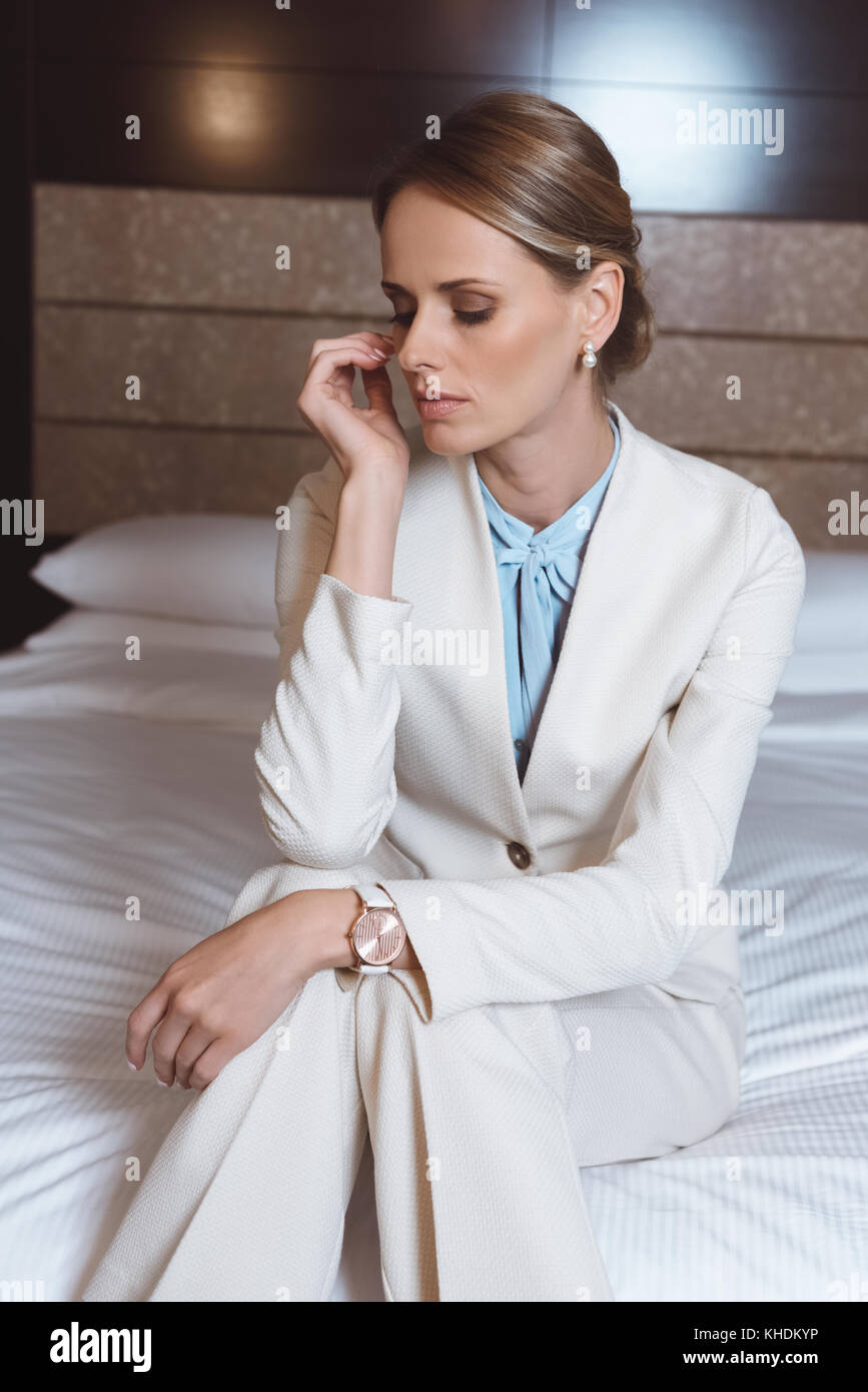 overworked businesswoman in hotel room Stock Photo - Alamy