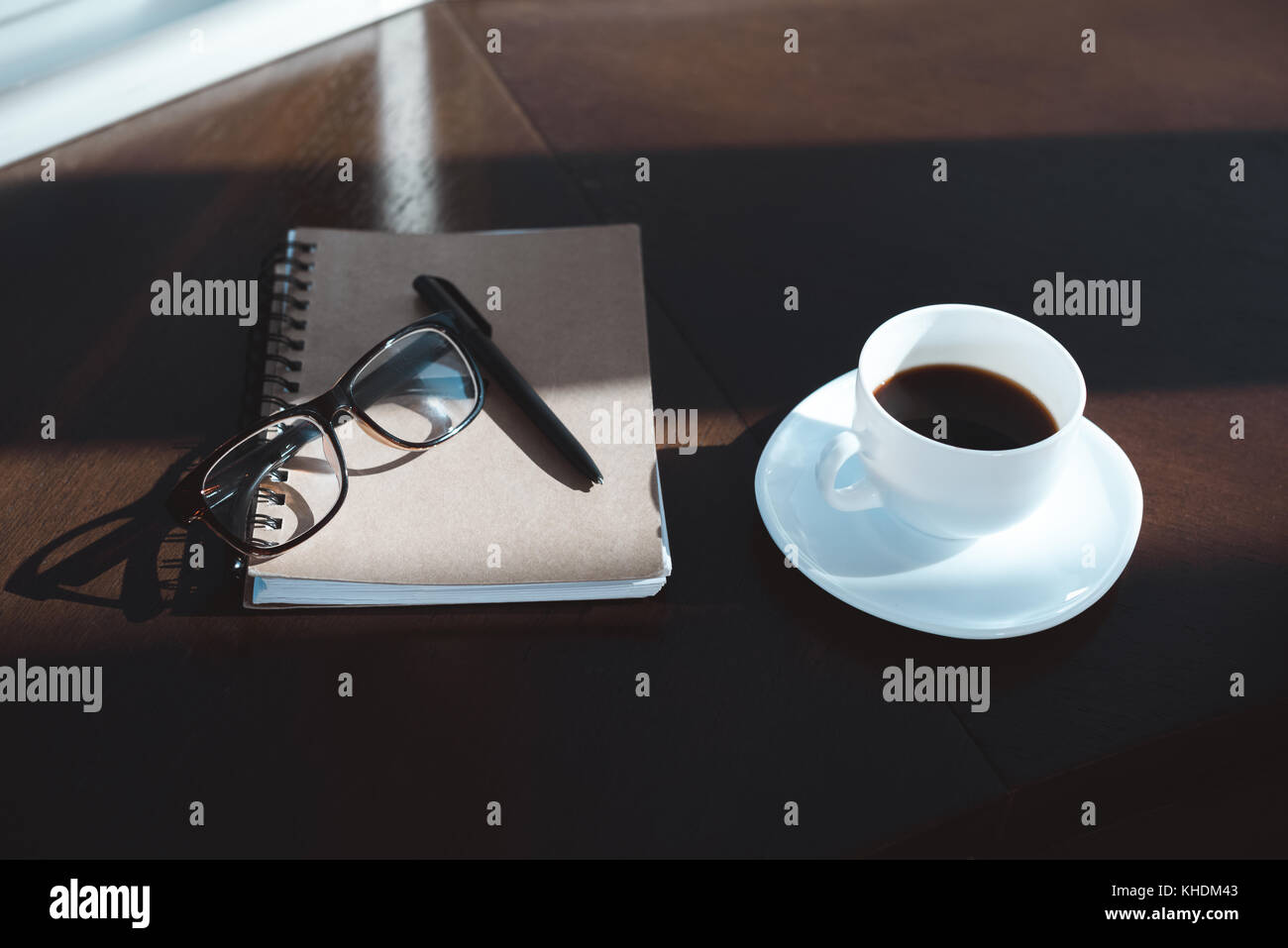 cup of coffee and notebook Stock Photo - Alamy