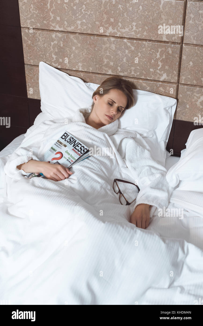 woman with magazine sleeping in bed Stock Photo - Alamy
