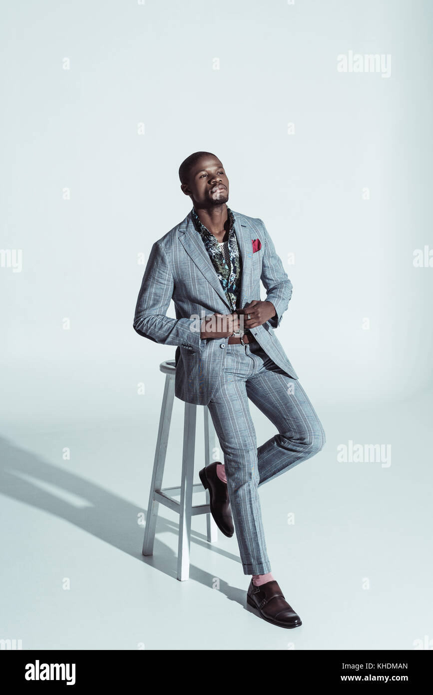 african american man in suit on bar stool Stock Photo - Alamy