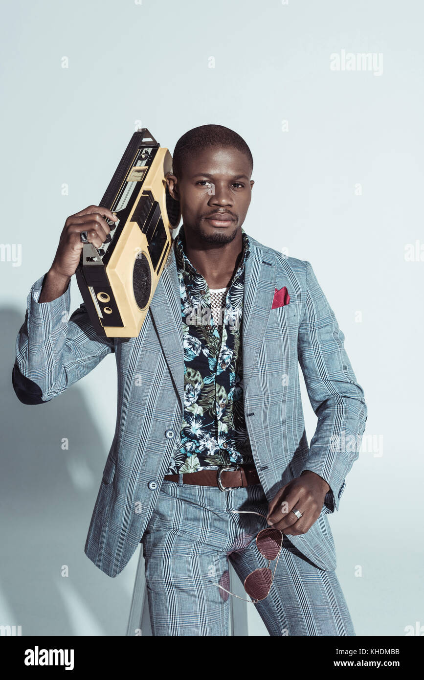 Stylish man holding boombox Stock Photo - Alamy