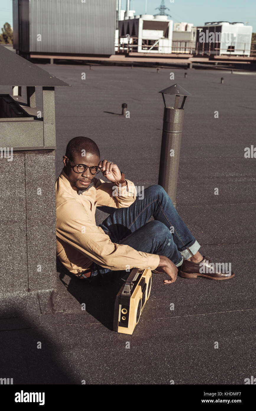 Man sitting on rooftop hi-res stock photography and images - Alamy