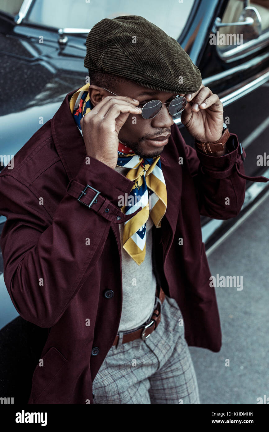 Fashionable man in front of car Stock Photo - Alamy
