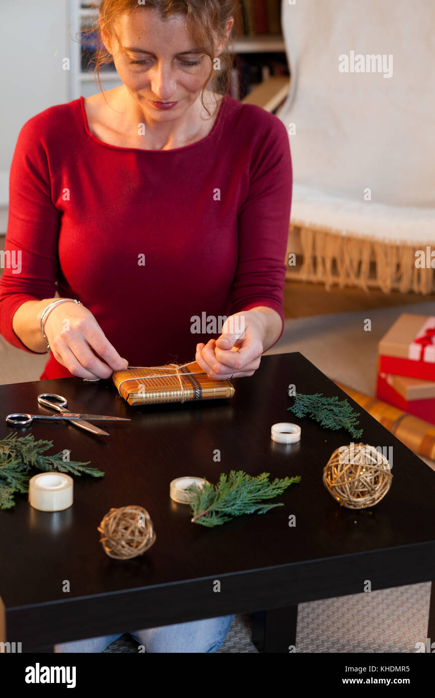 woman wrapping christmas presents Stock Photo - Alamy