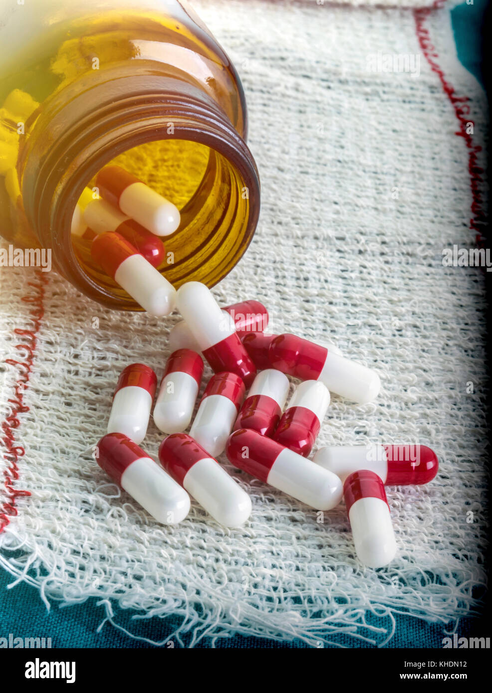 Some White And Red Pills Wrapped In Gauze Stock Photo - Alamy