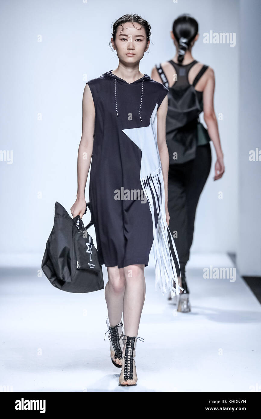 A model on the catwalk at the May Hsu show during Shanghai Fashion Week ...