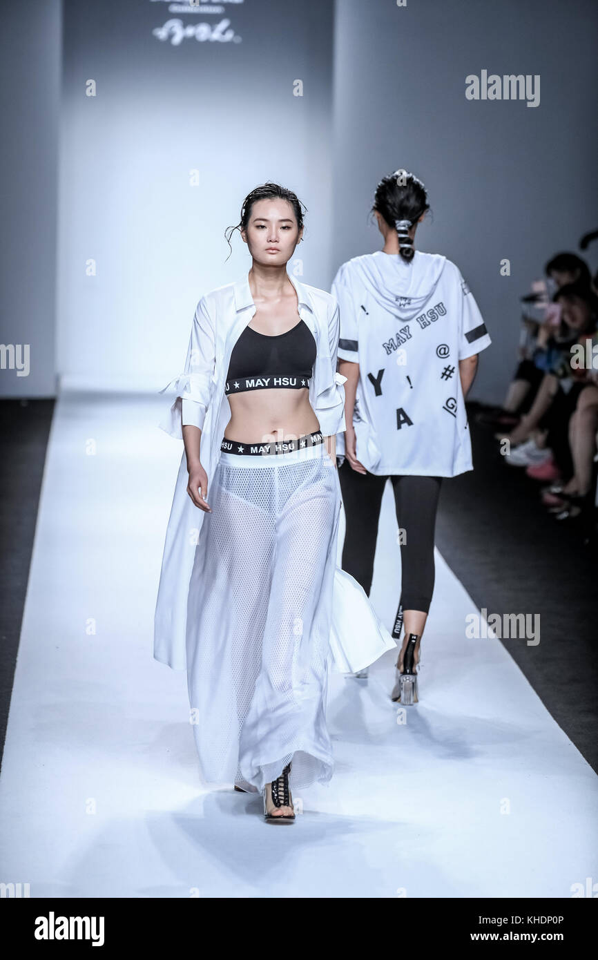 A model on the catwalk at the May Hsu show during Shanghai Fashion Week ...