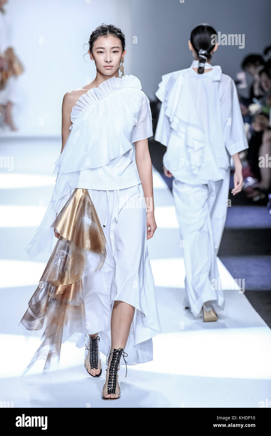 A model on the catwalk at the May Hsu show during Shanghai Fashion Week ...