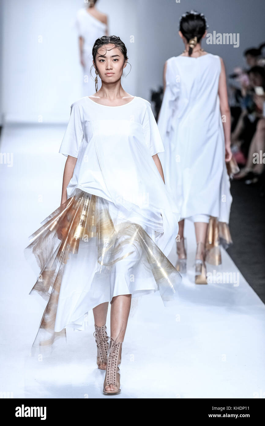 A model on the catwalk at the May Hsu show during Shanghai Fashion Week ...