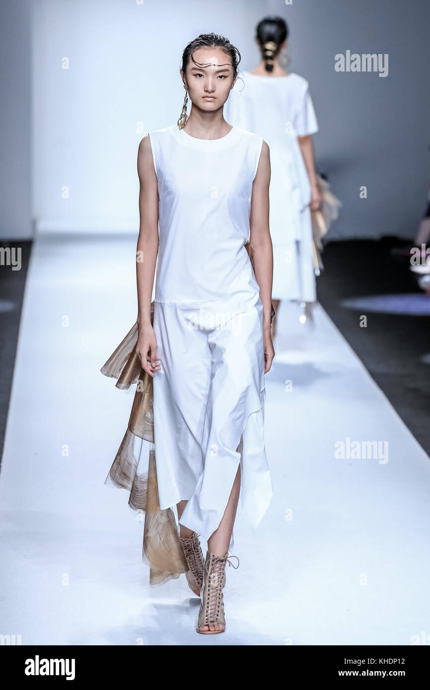 A model on the catwalk at the May Hsu show during Shanghai Fashion Week ...