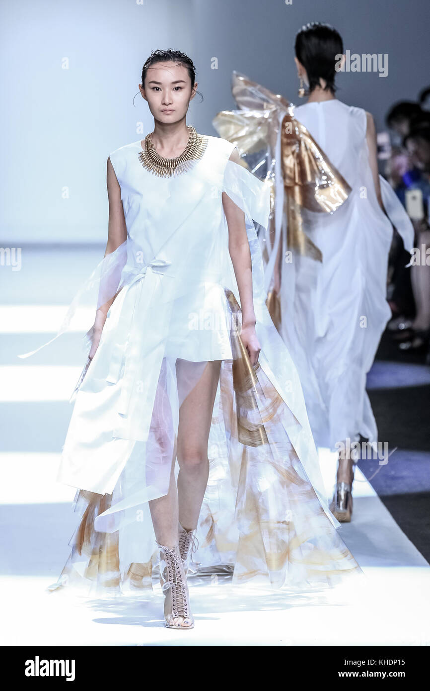 A model on the catwalk at the May Hsu show during Shanghai Fashion Week ...
