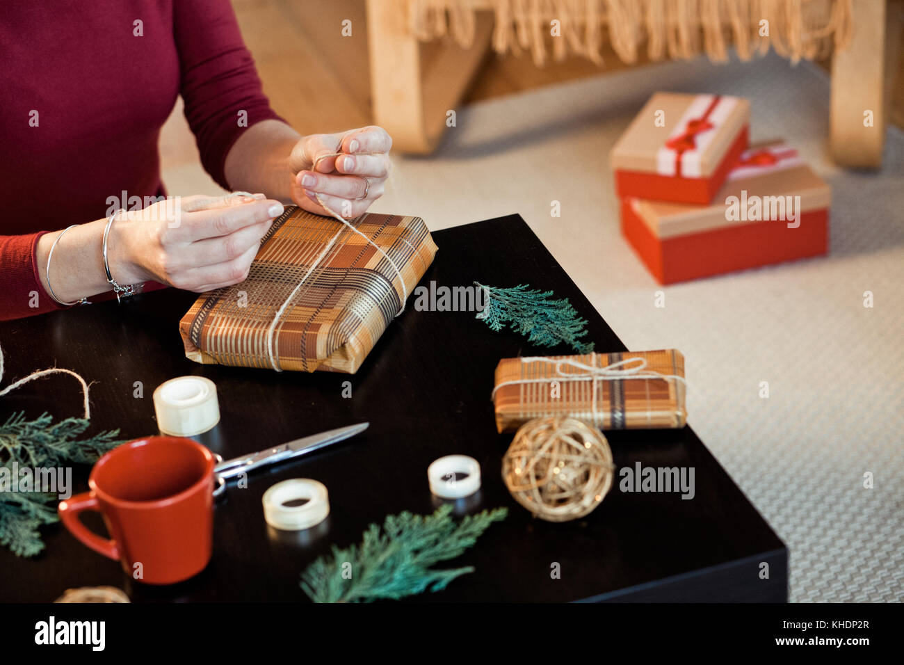 woman wrapping christmas presents Stock Photo - Alamy