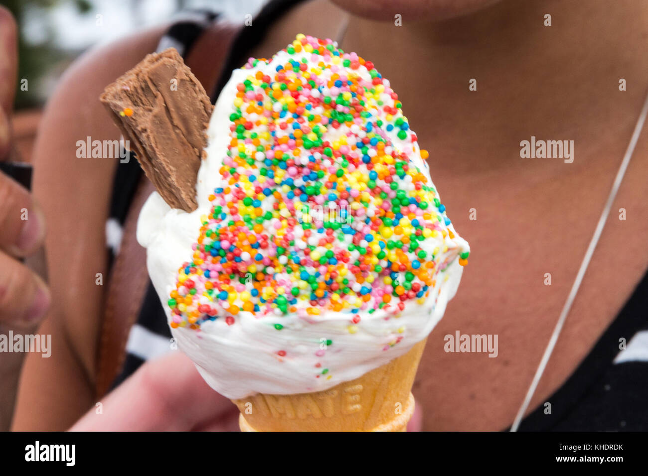Ice cream cone, with chocolate flake and colourful sprinkles Stock ...