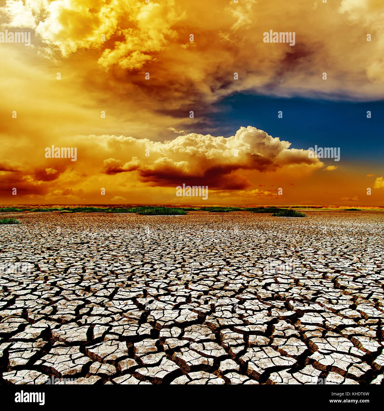 dramatic color clouds over drought earth Stock Photo - Alamy