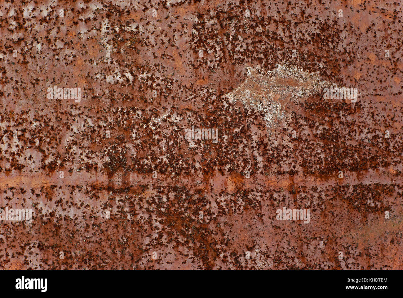 background, texture: surface of primed metal sheet with spots of rust ...